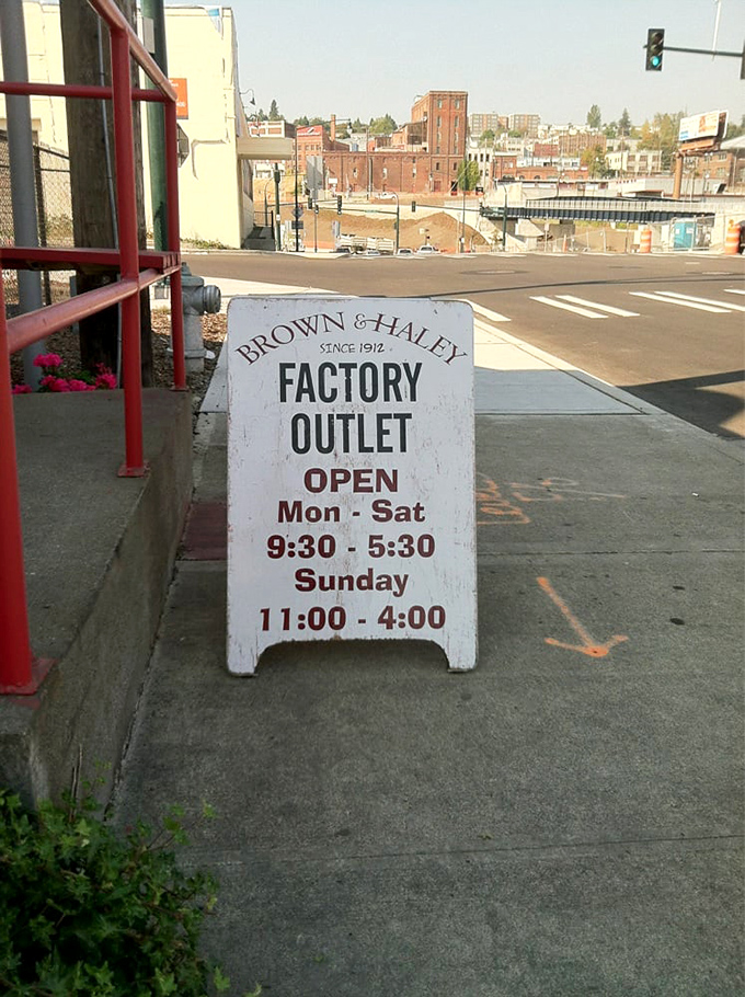 The unassuming sidewalk sign that separates ordinary days from extraordinary ones. Follow it to chocolate happiness.