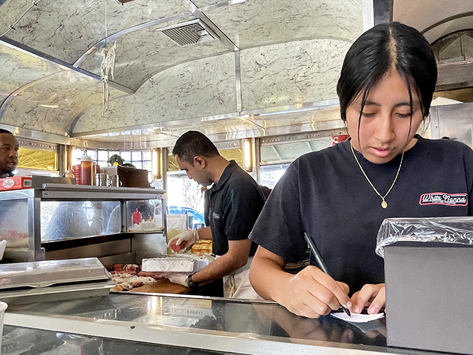 Order-taking is serious business when burger perfection is on the line. That focused expression says, "Your happiness is my mission."