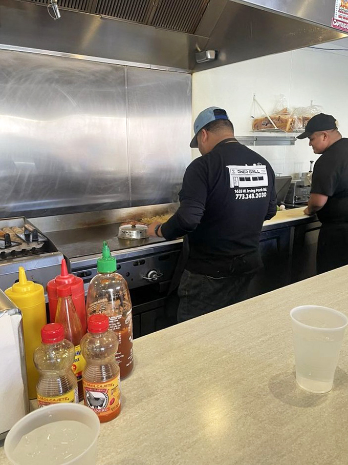 The true artists of Chicago work behind this grill, turning simple ingredients into masterpieces that have cured hangovers and broken hearts for decades.