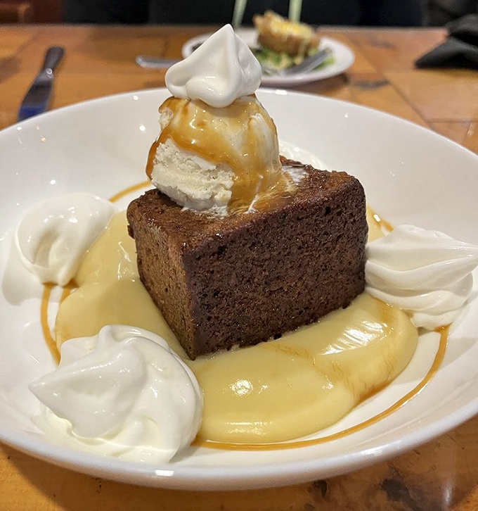 Sticky toffee pudding swimming in custard &ndash; proof that the British actually do understand dessert, despite centuries of culinary rumors to the contrary.