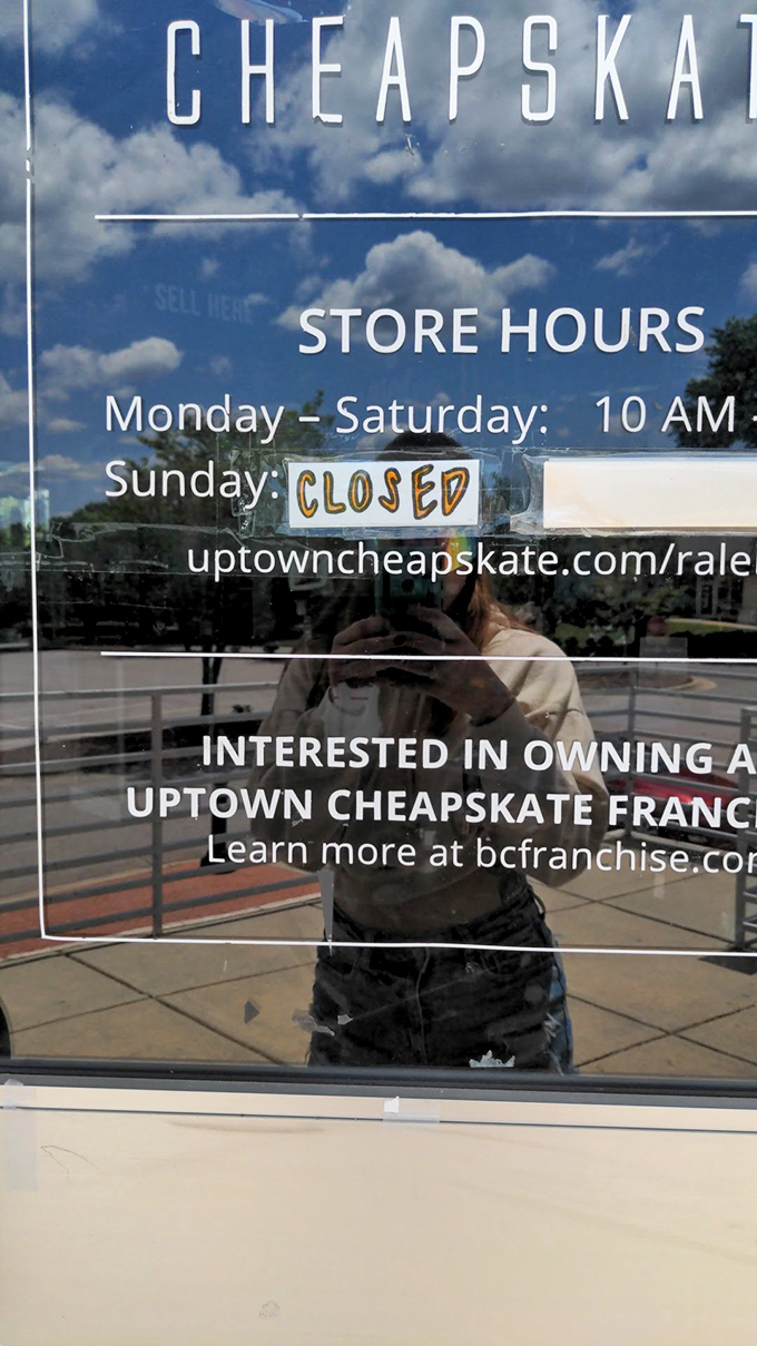 The store hours sign: crucial intelligence for planning your bargain reconnaissance missions. Closed Sundays for recovering from Saturday's shopping victories.
