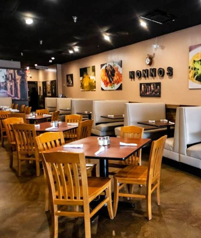 Wooden tables bathed in gentle lighting create the stage where pasta dreams come true. Every seat promises the same Italian escape. 