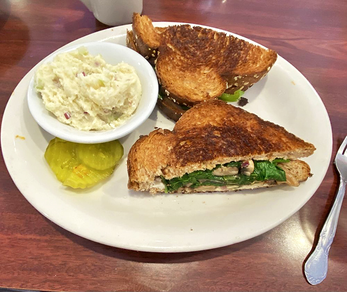Sandwich artistry that puts lunch counters on notice. Perfectly toasted bread with a side of potato salad that grandma would approve.
