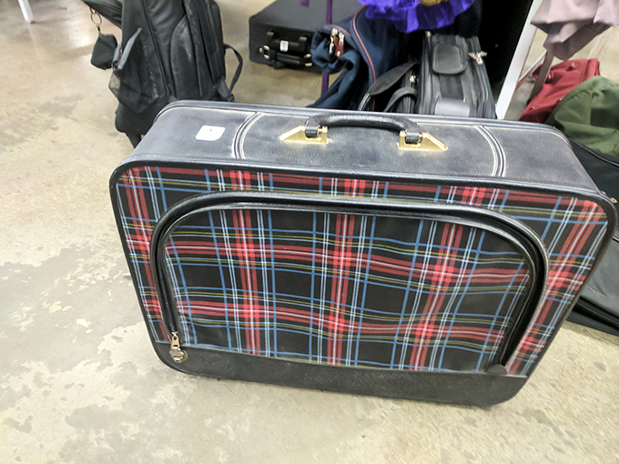 This plaid suitcase has stories to tell. Where will you take it next on its journey through time and travel?