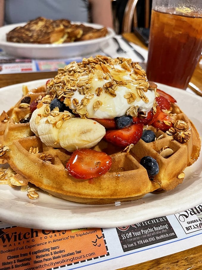 A waffle that's dressed better than most people at brunch &ndash; fresh berries, banana slices, yogurt, and granola creating a tower of morning magnificence.