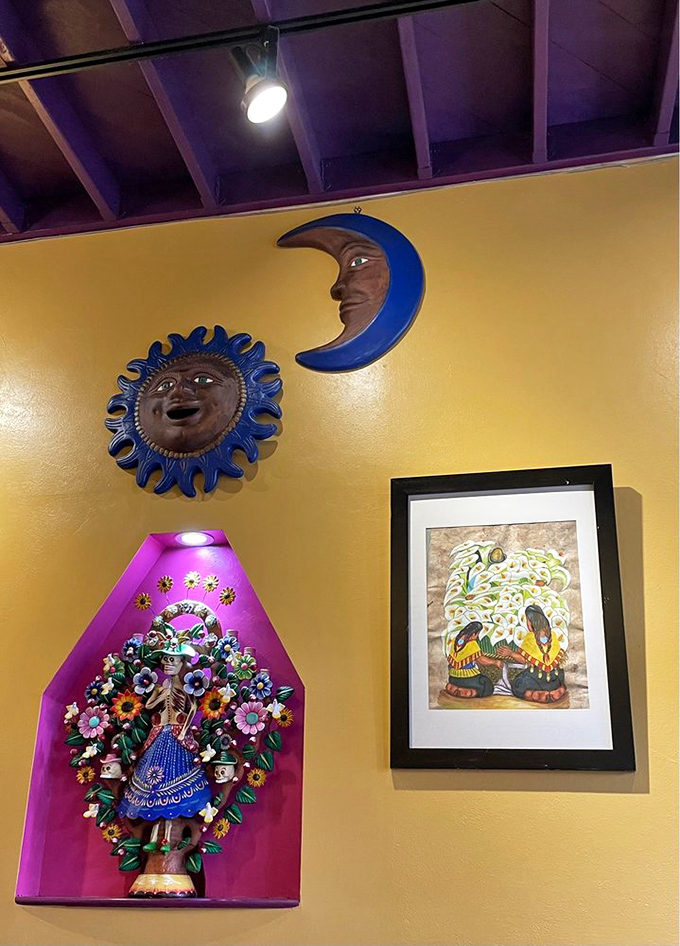 The sun and moon watch over diners from their perch on sunshine-yellow walls, alongside folk art that tells stories without saying a word.