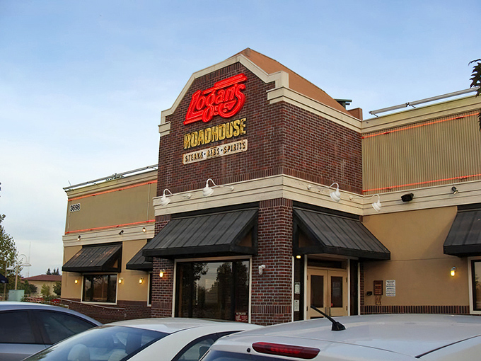 Logan's brick corner entrance beckons with the warm glow of a place where comfort food reigns supreme.