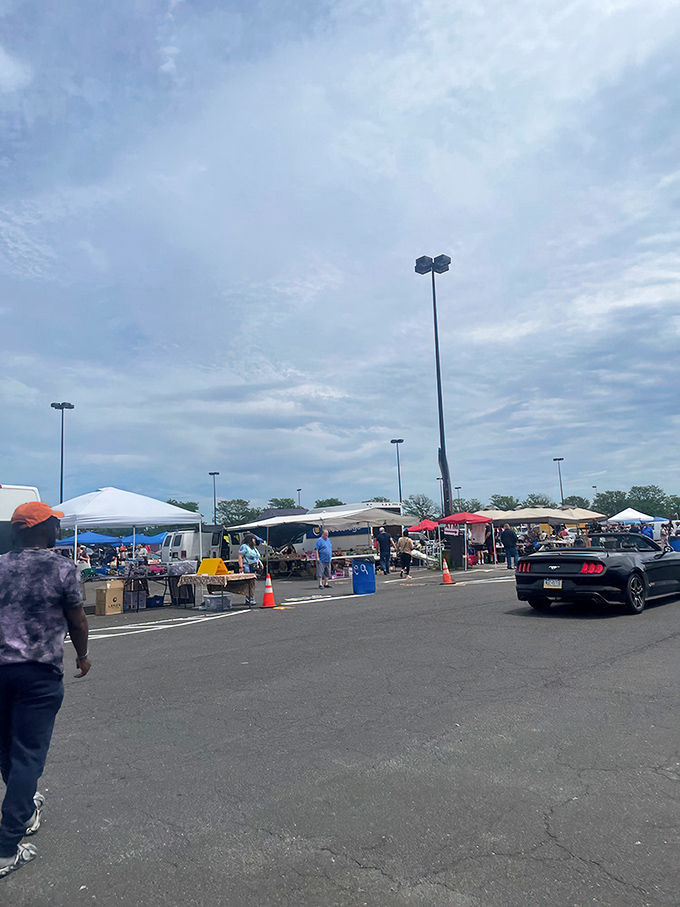 Tents of temptation line the pavement.
