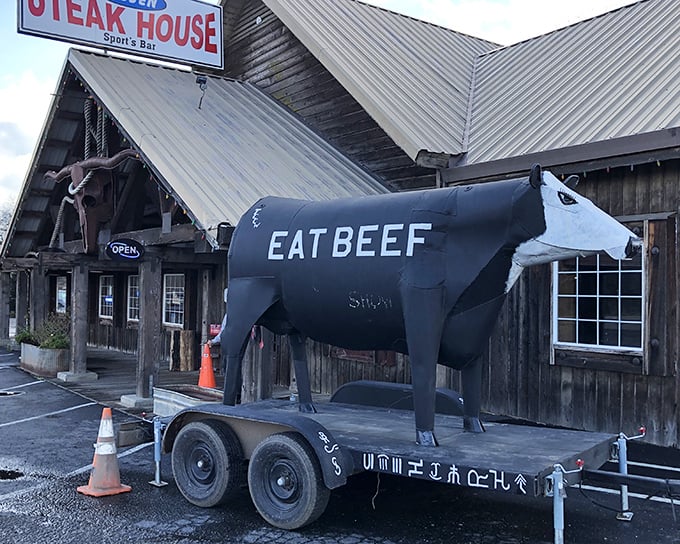 "EAT BEEF" commands the giant cow statue at Lassen Steakhouse - perhaps the most honest advertising in restaurant history.
