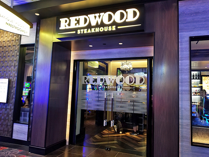 Warm woods and cool lighting create Redwood's inviting atmosphere, promising the kind of steakhouse experience Vegas was built on.