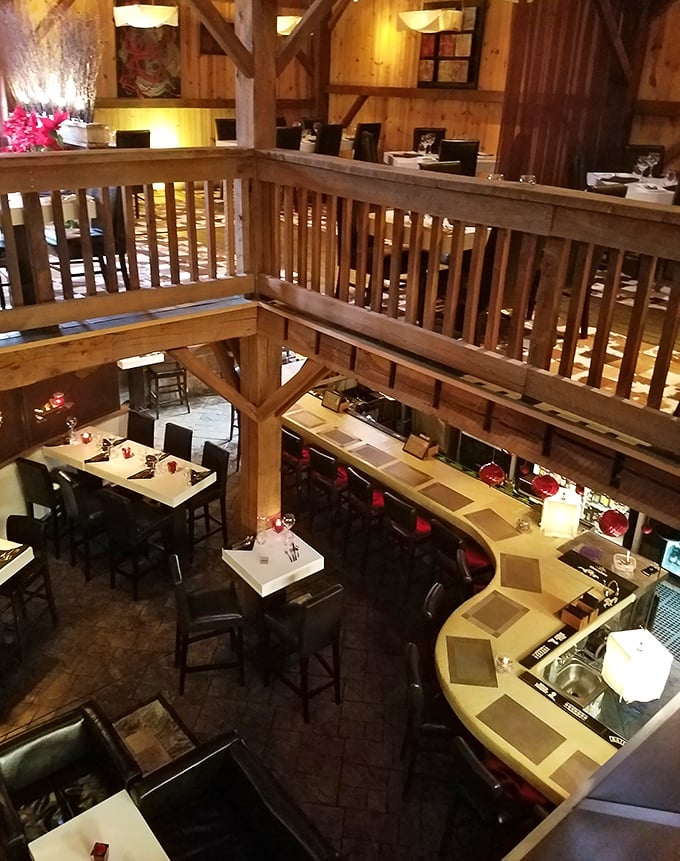 The second-floor dining area offers a bird's-eye view of the action below. Original wooden railings and beams create a treehouse feel for grown-ups. 