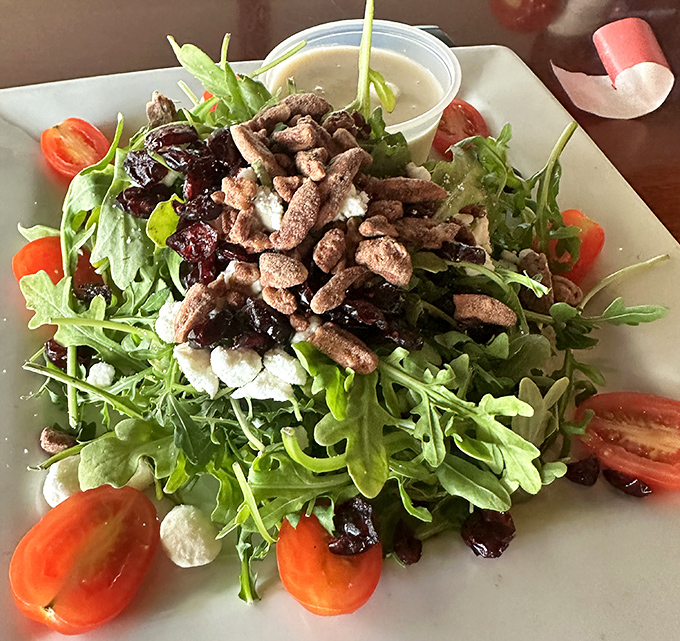 This isn't just a salad &ndash; it's a refreshing counterpoint to hearty German fare, where arugula, cranberries, and walnuts dance together in perfect harmony.