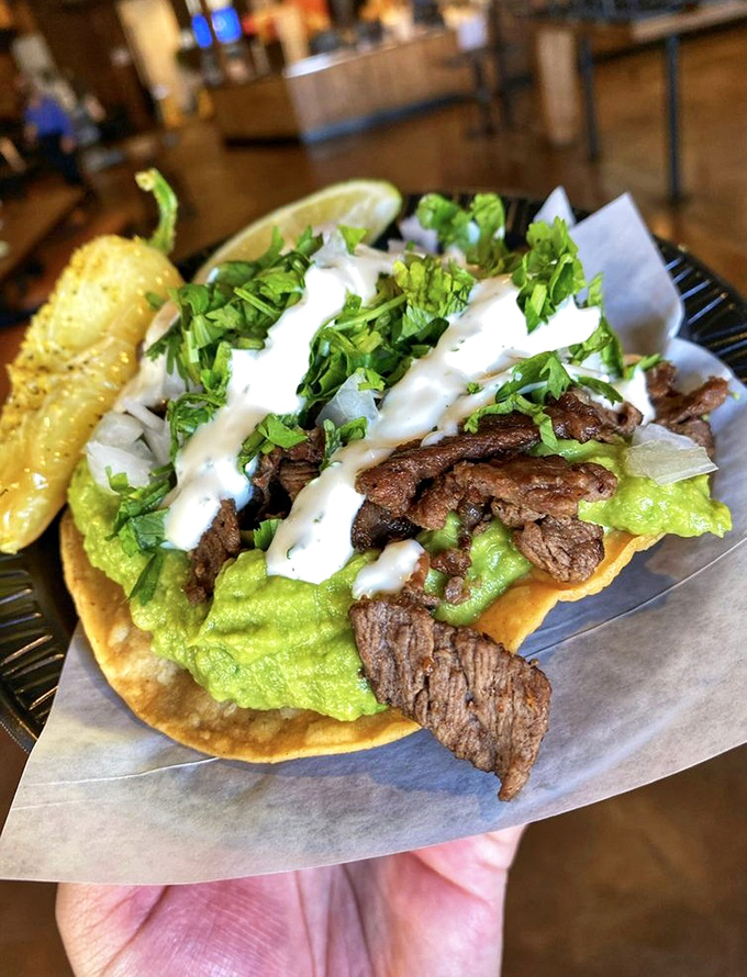 Tender carne asada piled high on a crispy tostada - street food elevated to an art form worth celebrating. 