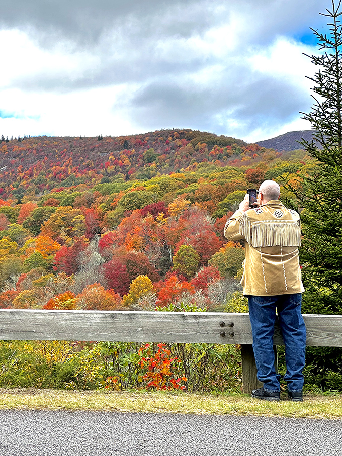 A photographer captures autumn's grand finale—nature's standing ovation in crimson, gold, and orange that makes professional fireworks seem quaint by comparison.