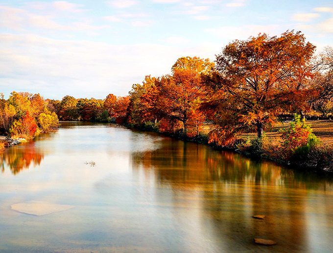 Fall foliage reflecting in the river creates a double feature of autumn splendor. Nature showing off for anyone smart enough to visit.