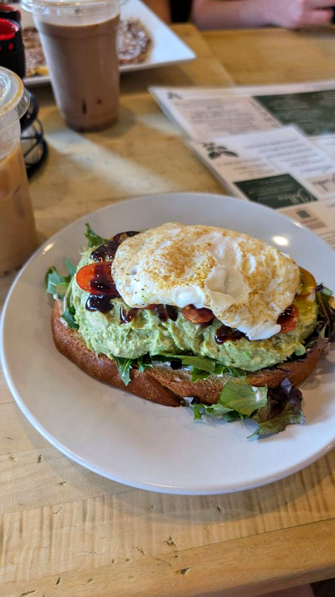 Avocado toast that makes millennials' housing decisions seem reasonable. That perfectly cooked egg on top is basically wearing a halo.
