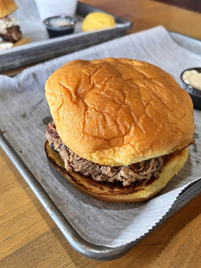 This pulled pork sandwich isn't just lunch—it's therapy between two buns. The kind that makes Monday meetings seem bearable again.