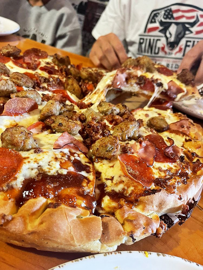 This isn't just a meat lover's pizza&mdash;it's a carnivore's manifesto in circular form. The cheese pull alone deserves its own Instagram account.