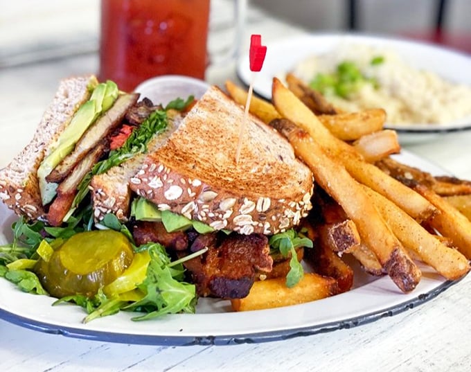 This isn't just a sandwich &ndash; it's architecture with purpose, where every layer from avocado to pork belly creates the perfect structural integrity.