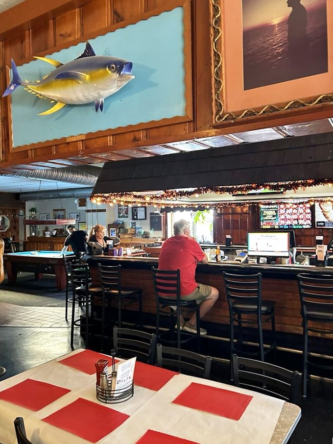 The bar area feels like Cheers for seafood lovers. That mounted fish has witnessed decades of first dates and celebration dinners.