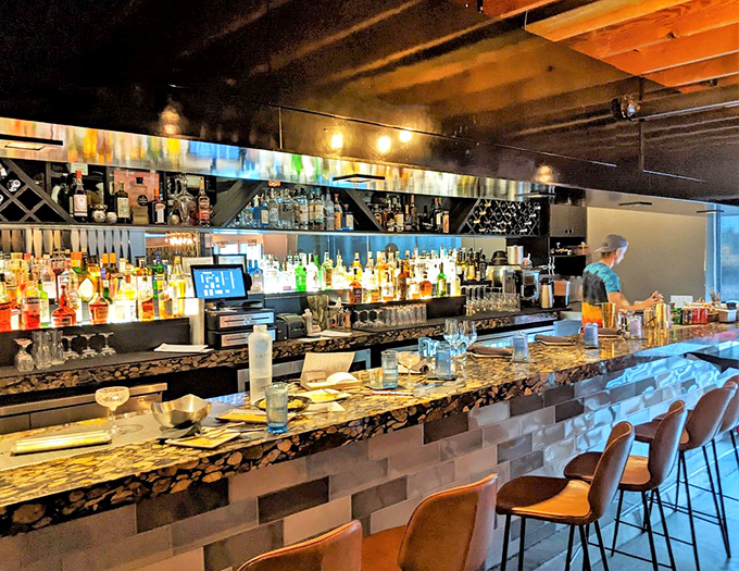 A bar stocked for serious cocktail crafting. Those bottles aren't just decoration&mdash;they're waiting to become your next favorite libation.