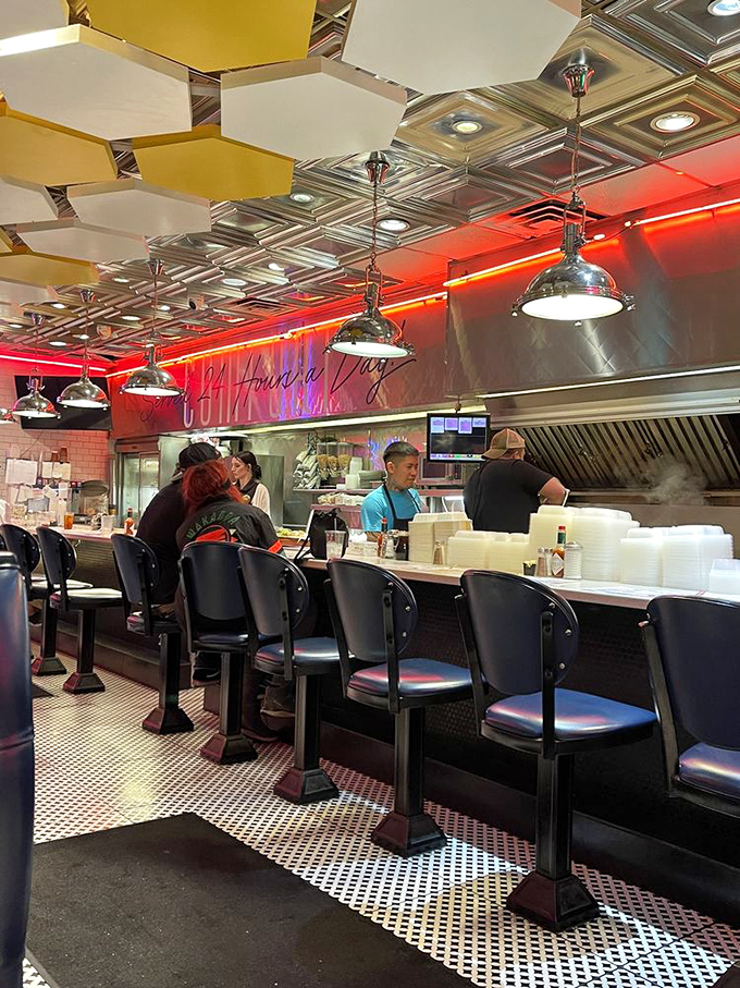 Counter seating: where solo diners become part of the show. Front-row tickets to the breakfast ballet performed by short-order maestros.