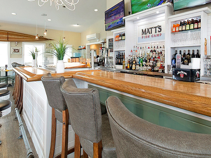 The wooden bar top gleams with promise, while those sea-blue chairs invite you to settle in and make an afternoon of it.