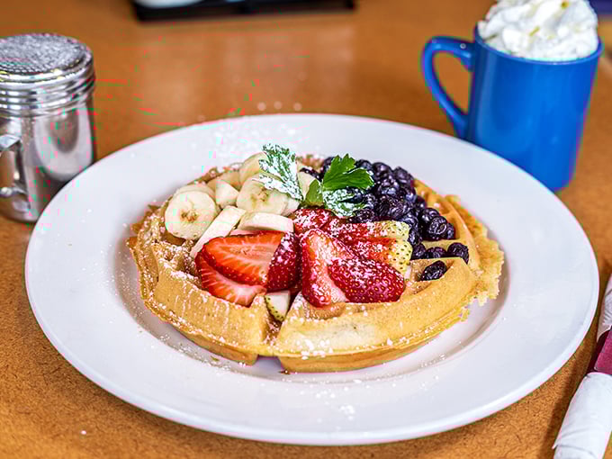 This waffle doesn't just hold berries and bananas—it showcases them like precious jewels on a delicious pedestal.