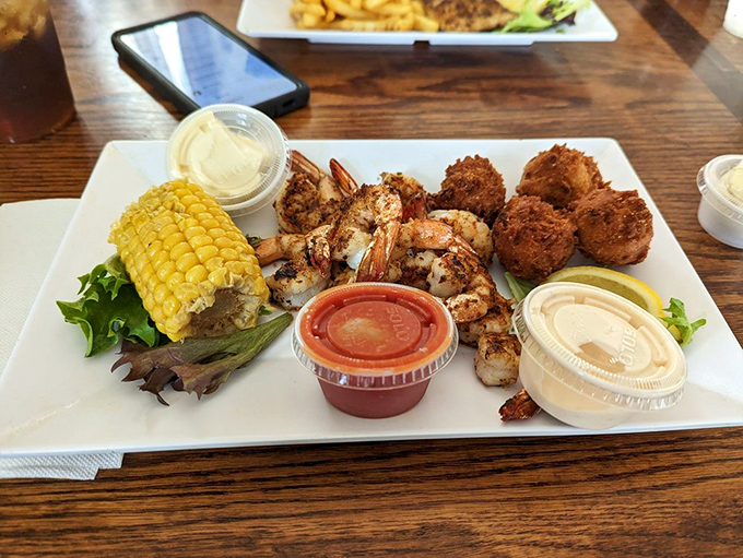 A plate that answers the eternal question: "What if we took perfect shrimp, added hush puppies and corn, then made Wednesday taste like vacation?"