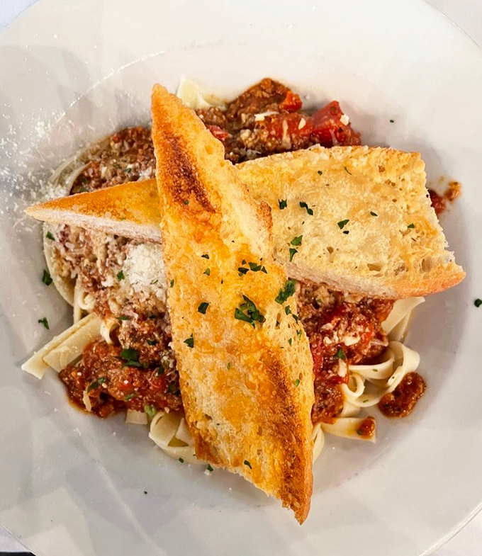 This pasta isn't just topped with sauce—it's been introduced to its soulmate in a rich, meaty Bolognese that's clearly in it for the long haul.