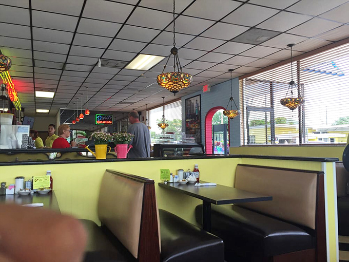 Cozy booths where countless coffee refills and life stories have been shared&mdash;the yellow walls practically radiating Florida sunshine.