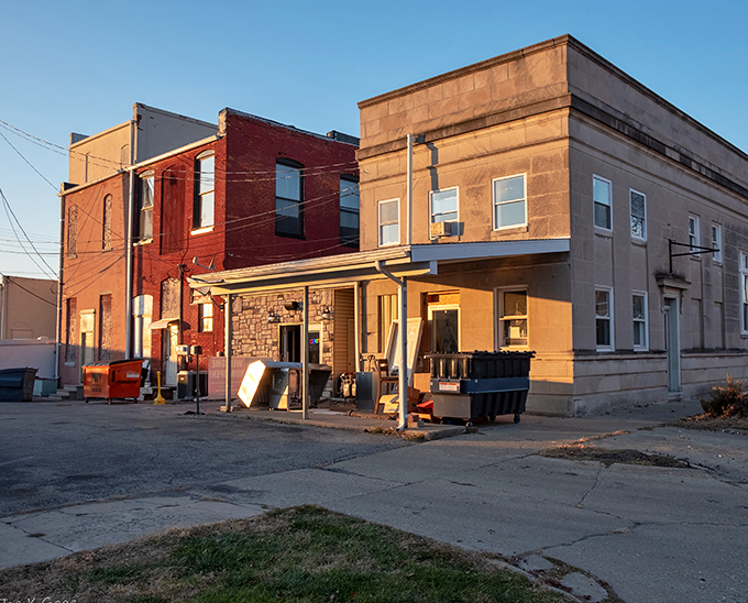 This unassuming back entrance to what appears to be Broomtown Cafe captures that golden-hour light that makes everything look like a memory.