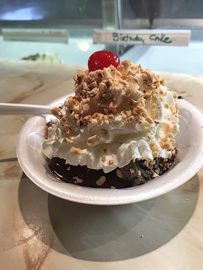 A mountain of whipped cream and nuts crowns this brownie sundae&mdash;dessert architecture that deserves its own blueprint.
