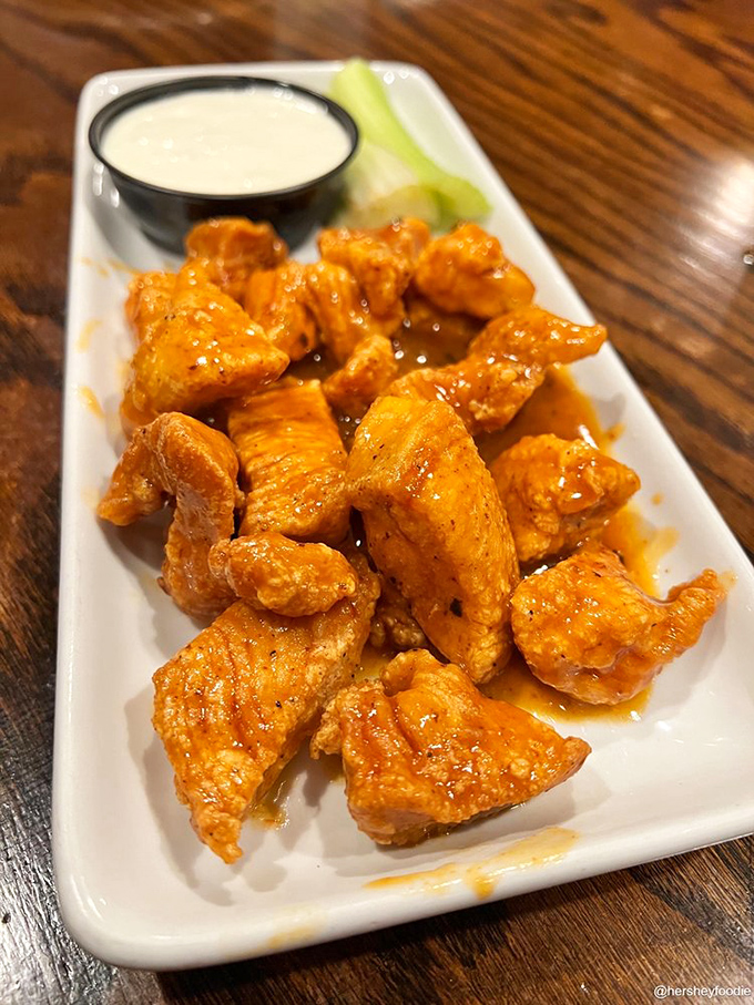 Buffalo bites that bring the heat but keep their manners. The cooling dip stands by like a faithful friend when things get spicy.
