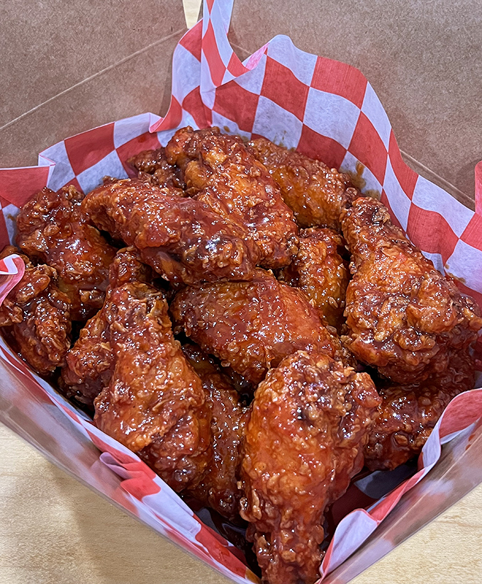 Buffalo wings with the kind of sticky, finger-staining sauce that makes you forget about table manners and social graces.