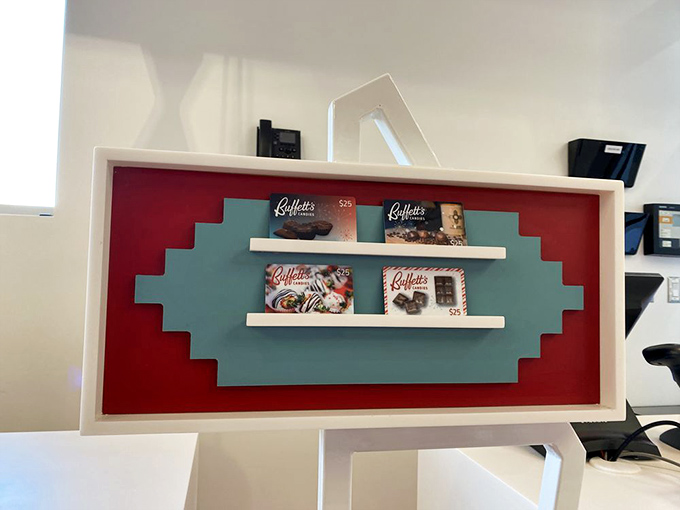 Red and turquoise accents channel classic New Mexico style while the pristine display cases showcase confections worthy of museum-quality presentation.