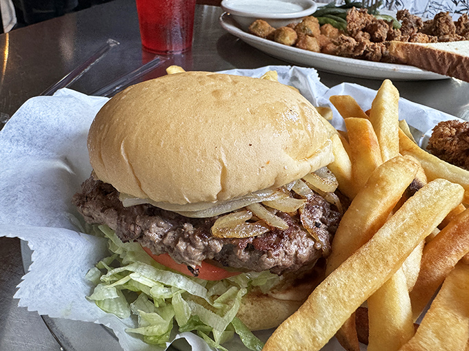This isn't just a burger&mdash;it's a hand-formed masterpiece topped with grilled onions that have achieved perfect caramelization nirvana.