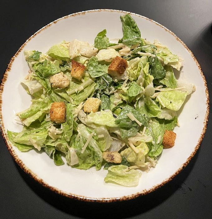 A Caesar salad that actually tastes like something&mdash;crisp, tangy, and the perfect opening act before the meaty main event takes the stage.