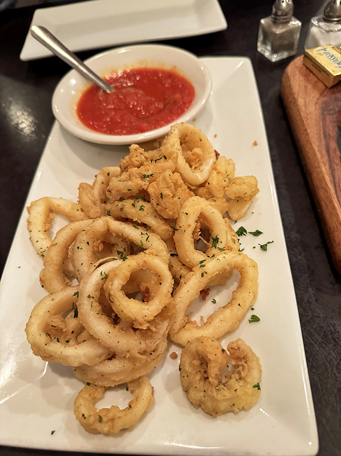 These golden-fried calamari rings aren't just appetizers&mdash;they're crispy halos that make you believe in a benevolent culinary universe.