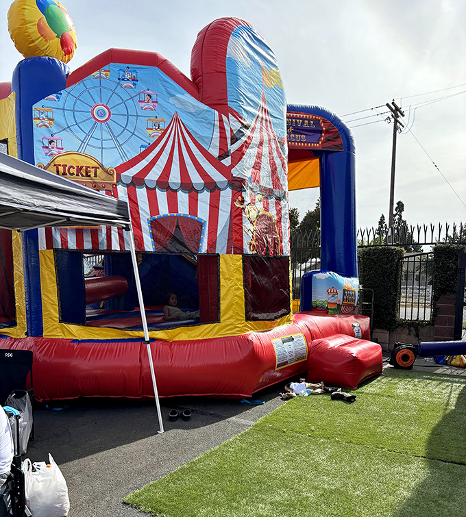 Who needs Disneyland when bouncy castle joy awaits? This inflatable playground brings carnival thrills to the market's youngest visitors.