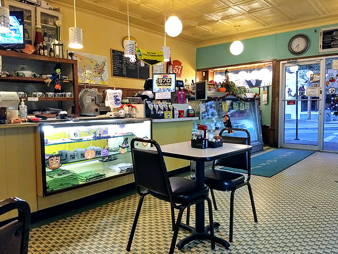 The counter view reveals the diner's beating heart &ndash; display case of treats, vintage memorabilia, and the promise of homestyle cooking just steps away.
