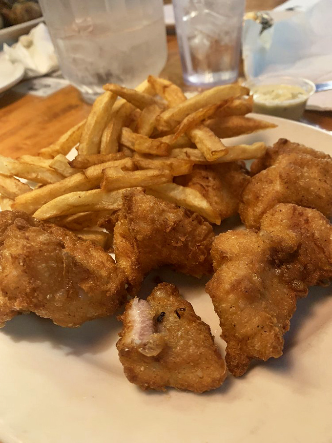 Crispy catfish that shatters with each bite, paired with golden fries &ndash; proof that sometimes the simplest preparations yield the most satisfaction.