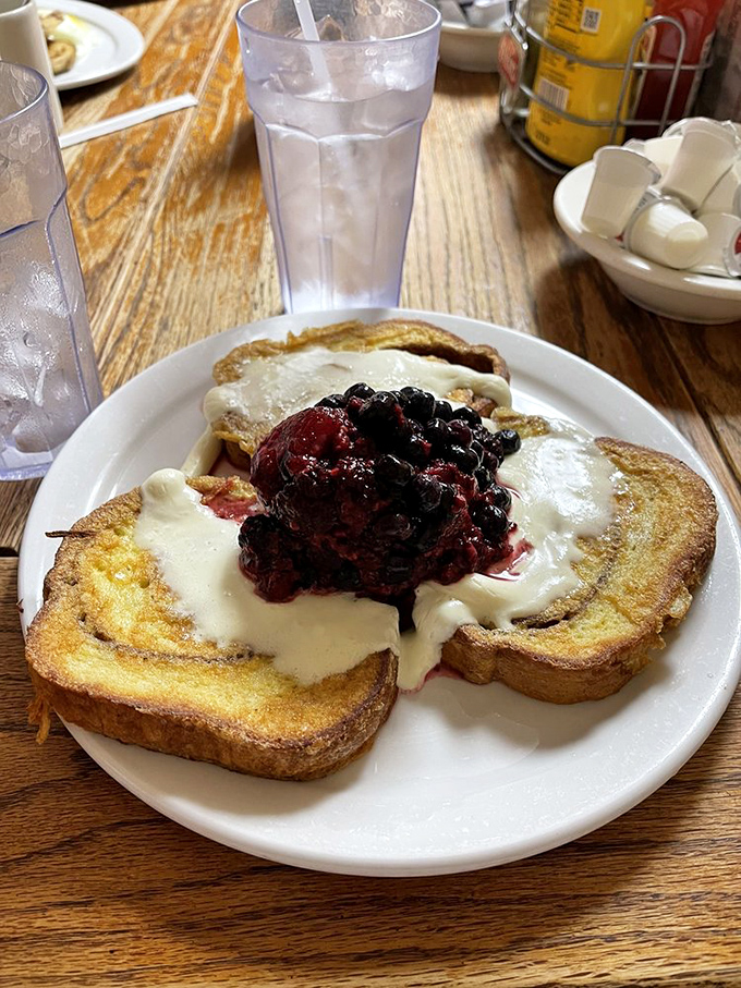 French toast that's having an identity crisis as cheesecake &ndash; and we're completely fine with that. The berry topping adds a perfect tart contrast.