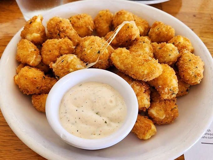 Golden-fried cheese curds with a side of creamy dipping sauce&mdash;proof that appetizers before breakfast should be more socially acceptable.