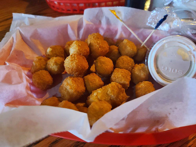 Golden-fried cheese curds &ndash; little nuggets of joy that somehow manage to disappear from the basket faster than you can say "just one more."