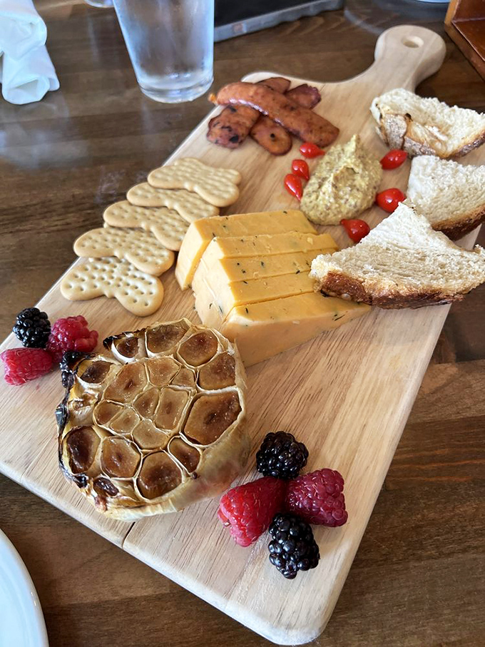 Cheese and charcuterie presented with artistic flair&mdash;a wooden board of possibilities where every bite tells a different delicious story.