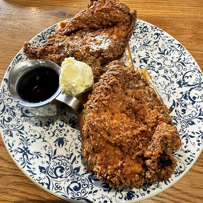 Fried chicken so perfectly golden it deserves its own Instagram account, served with waffles that understand the assignment.