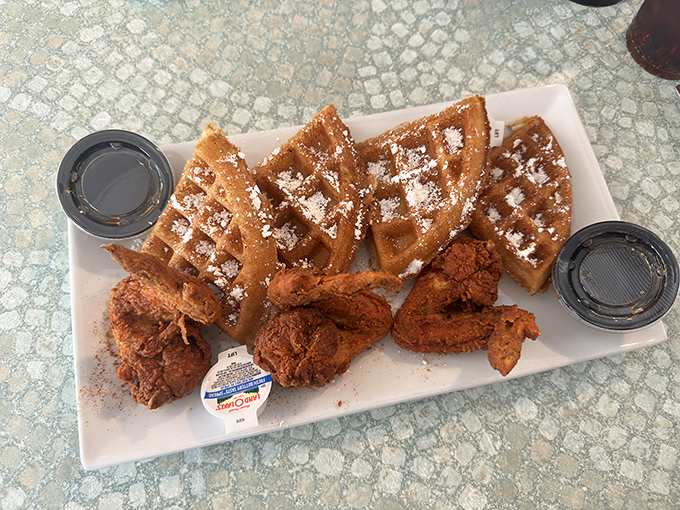 Chicken and waffles – the breakfast-dinner hybrid that proves some of the best relationships are unexpected ones, especially when maple syrup is involved.