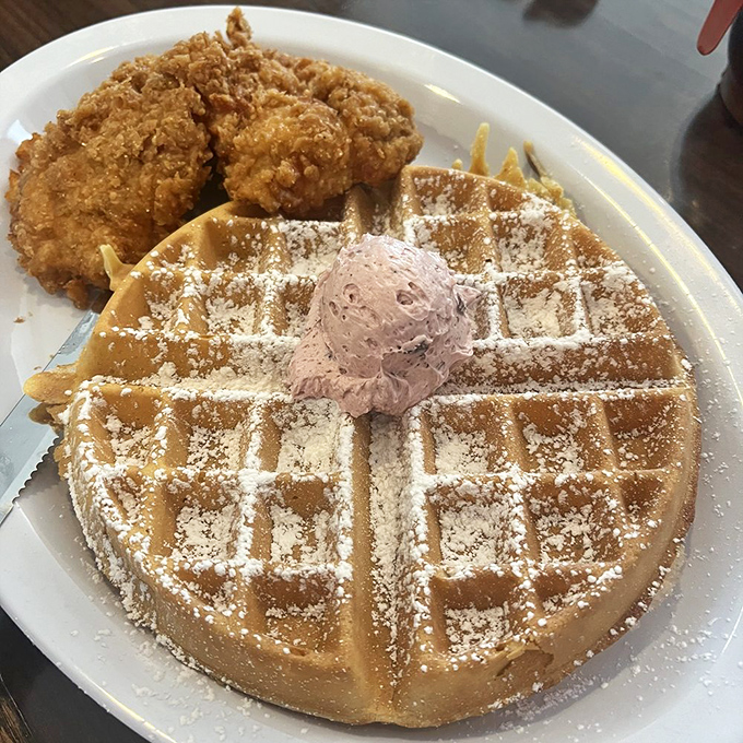 The eternal breakfast debate&mdash;sweet or savory&mdash;solved on a single plate. Golden waffle meets crispy chicken in a combination that shouldn't work but absolutely does.