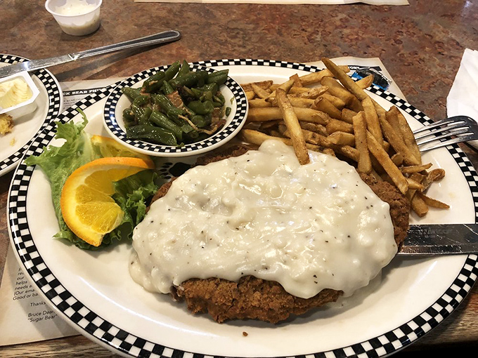 Chicken fried steak swimming in country gravy with a side of green beans&mdash;proof that dinner at a breakfast joint can be just as spectacular as morning fare.